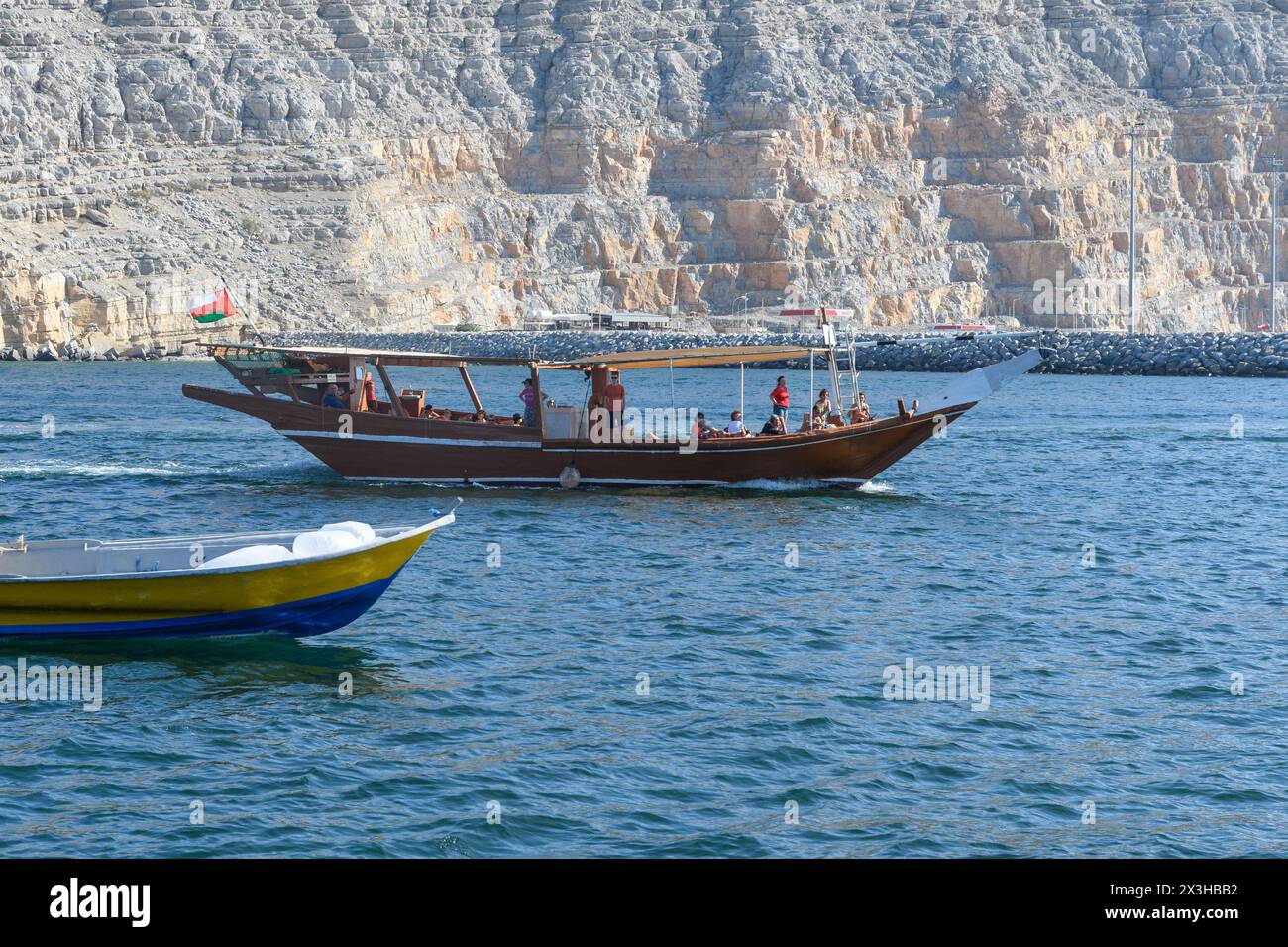 Khasab, Oman - 1 January 2024: Tourists aboard a traditional Omani boat ...