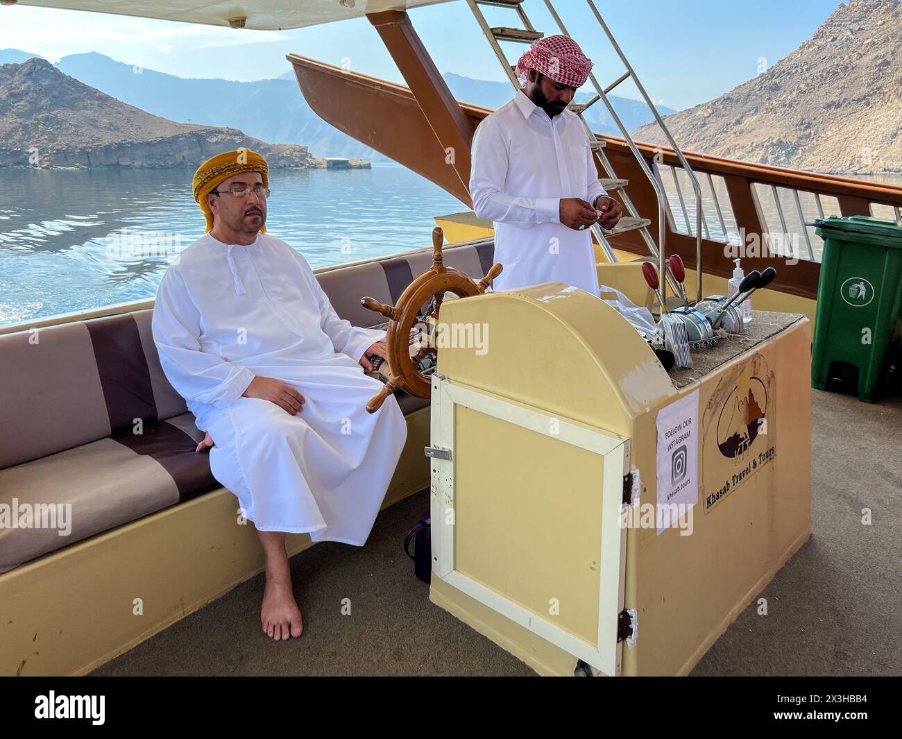 Khasab, Oman - 1 January 2024: Dressed in traditional attire, travelers ...