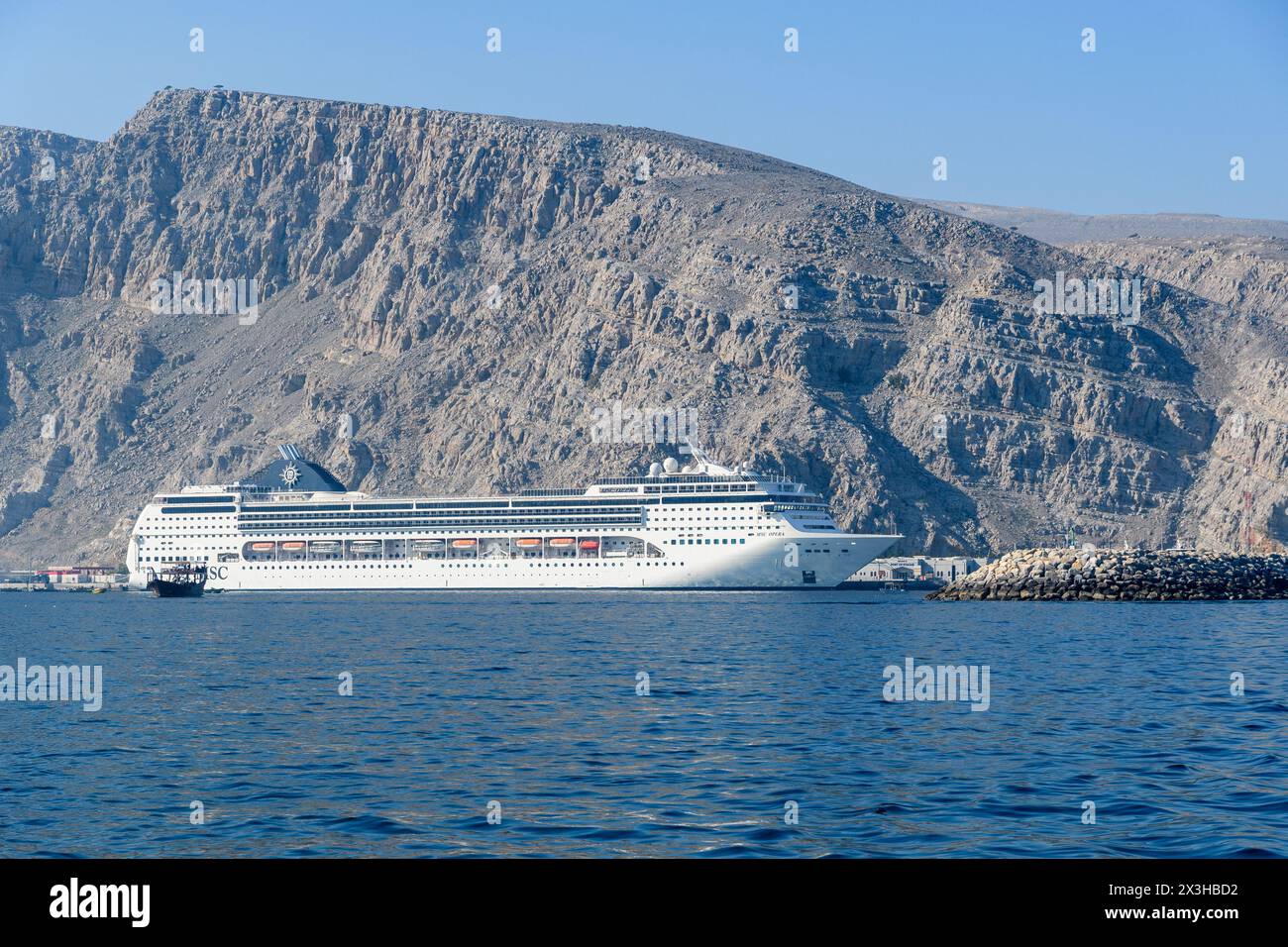 Khasab, Oman - 1 January 2024: A majestic white cruise ship docked near ...