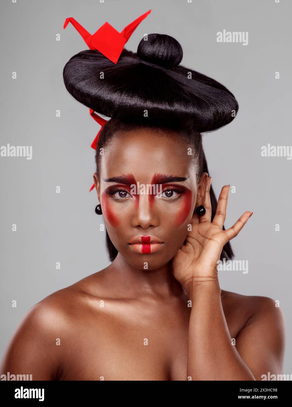 Creative beauty, face and black woman with origami in studio isolated ...