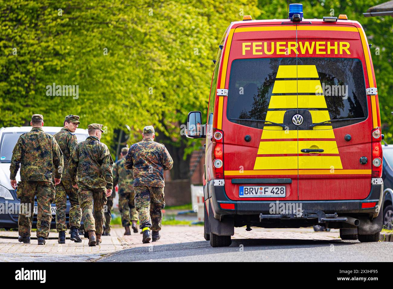 Elm, Germany. 27th Apr, 2024. Bundeswehr soldiers walk along a street ...