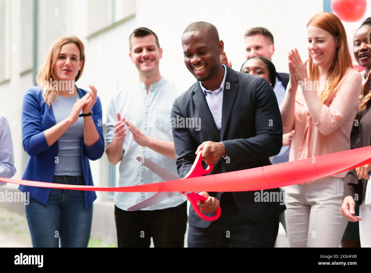 Outdoor Black Ribbon Cutting Ceremony for New Business Stock Photo - Alamy