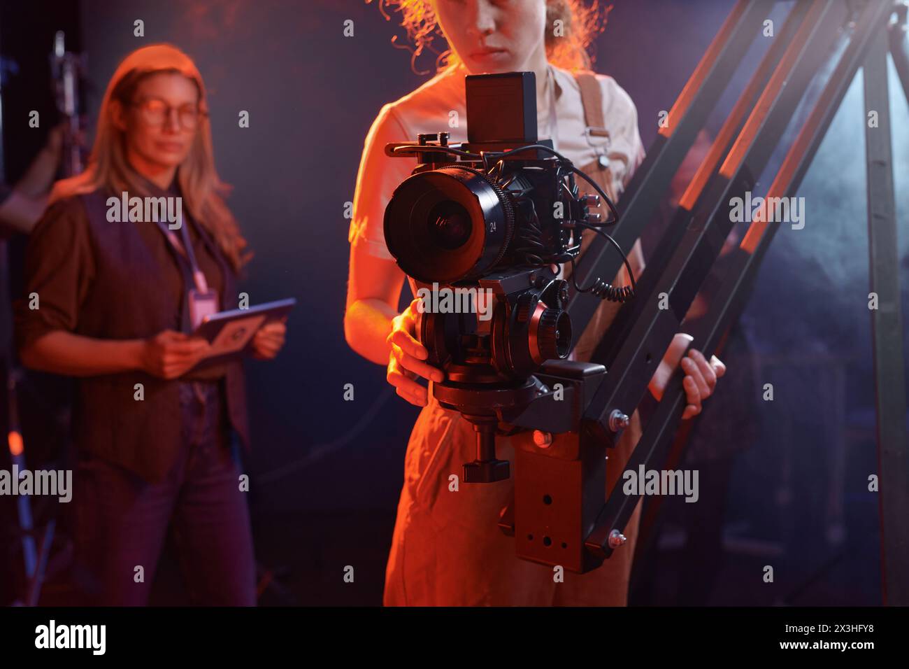 Cameraman young woman movie camera hi-res stock photography and images ...