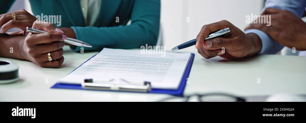 Two business people reviewing documents hi-res stock photography and ...