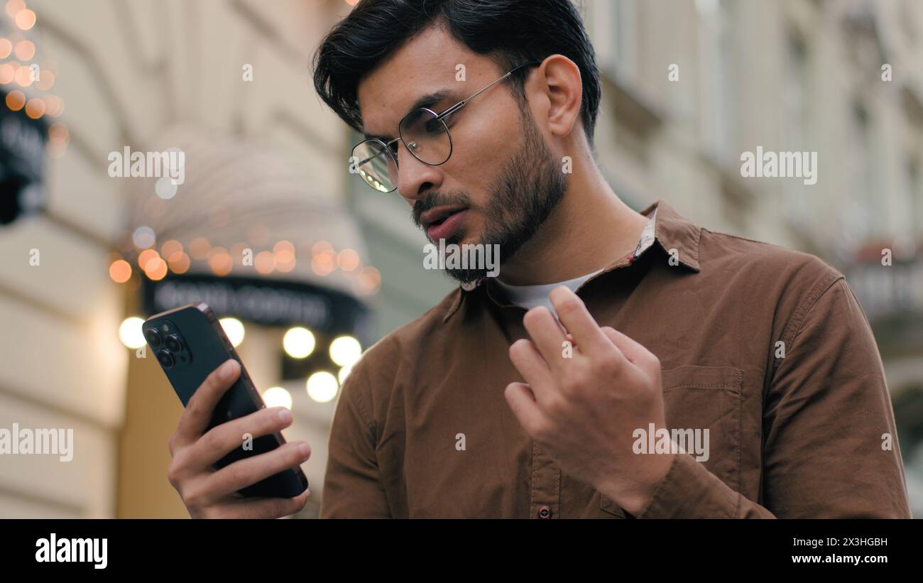 Close up upset unhappy Indian Arabian ethnic man young guy businessman ...