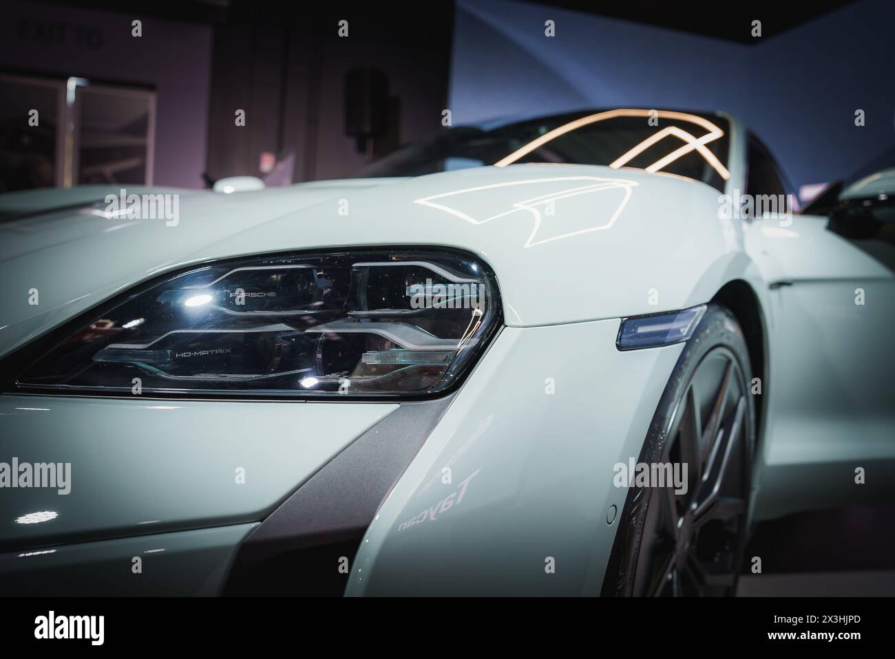 Glossy white luxury car with LED headlight in indoor setting Stock ...