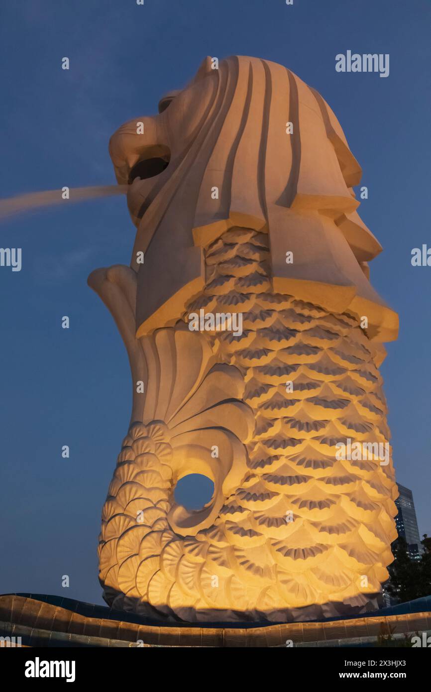 The Merlion statue in Singapore illuminated at night Stock Photo - Alamy