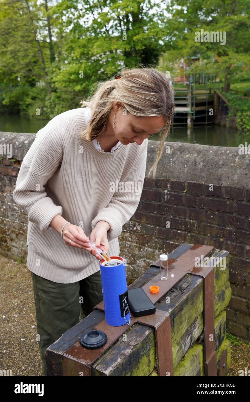 River Action Communities Coordinator Chloe Peck tests a water sample ...