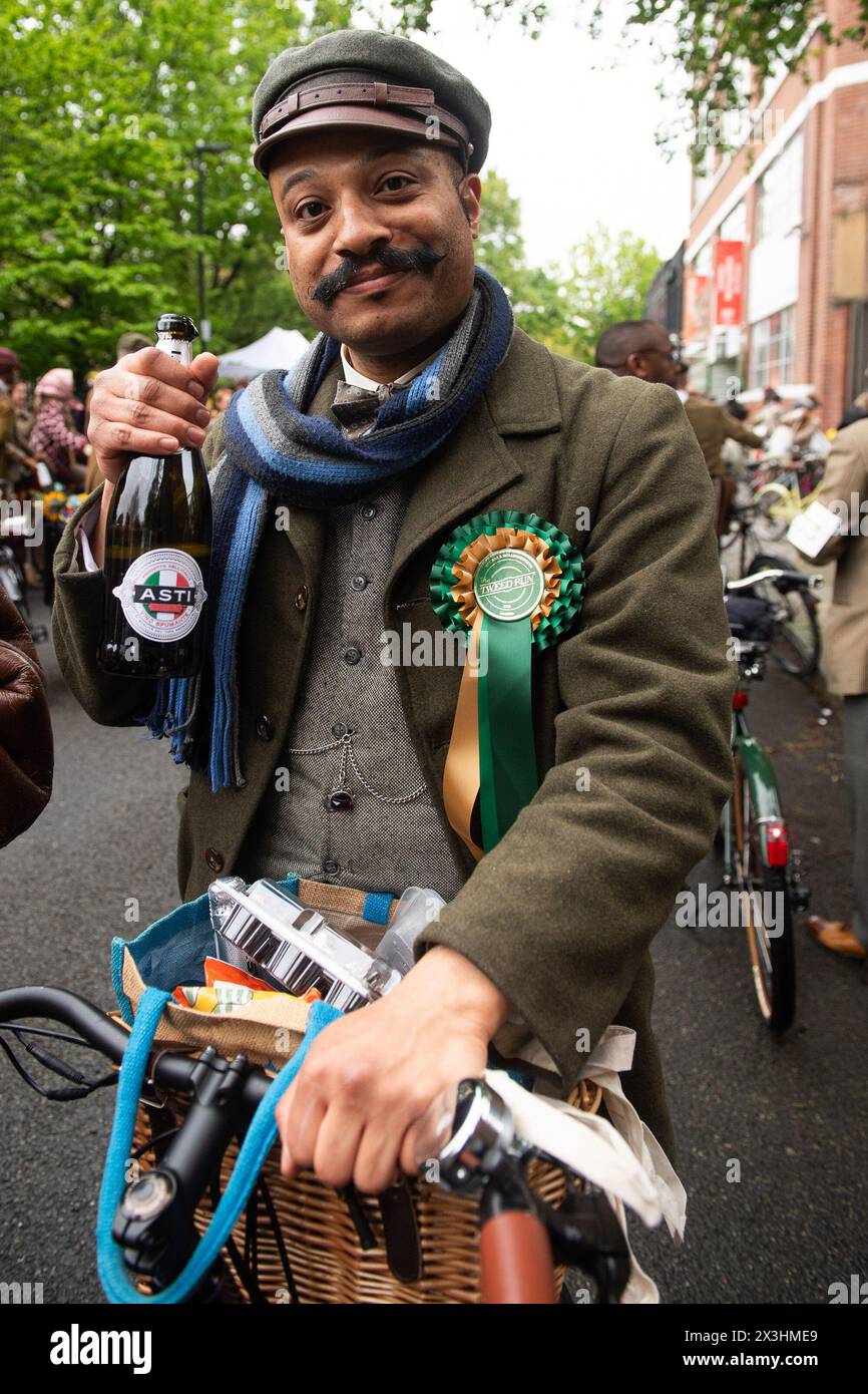 London, UK. 27 Apr 2024. Participants in the Tweed Run pose for a photo in Clerkenwell. Credit ...