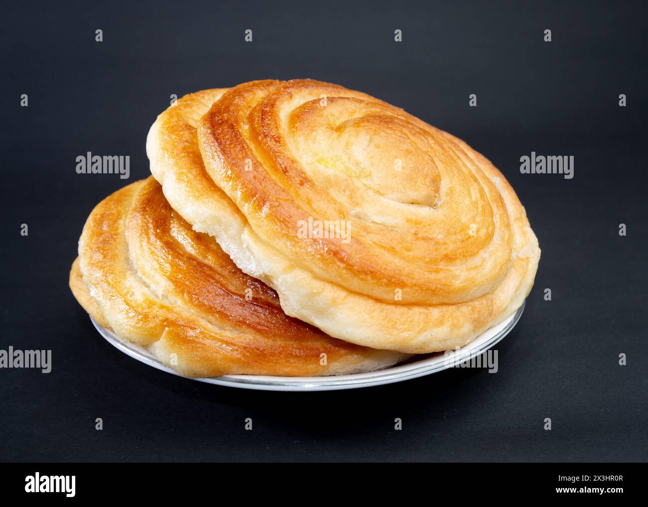 Danish pastry on black background Stock Photo - Alamy