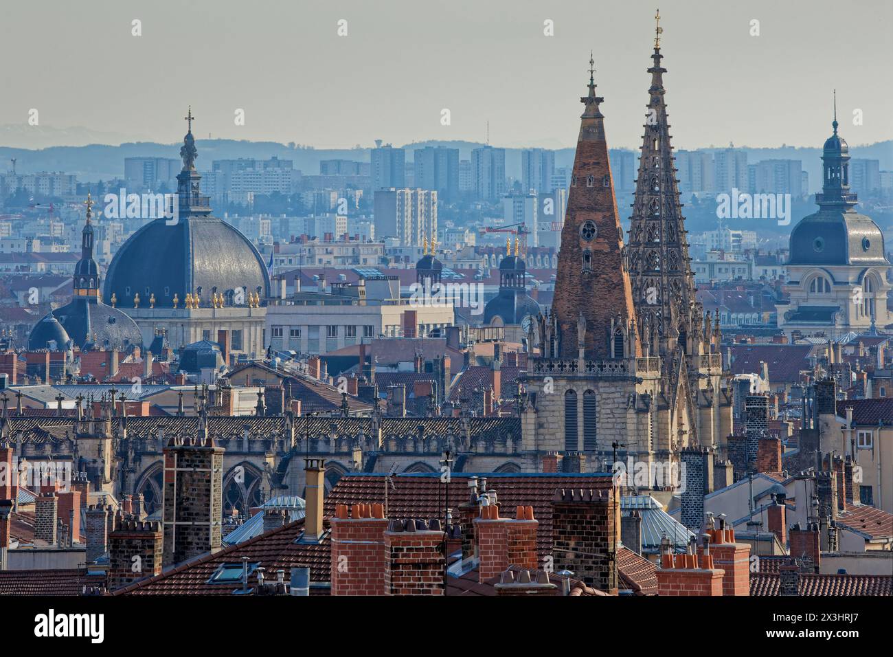 Roofs and bell towers over the city of Lyon Stock Photo - Alamy