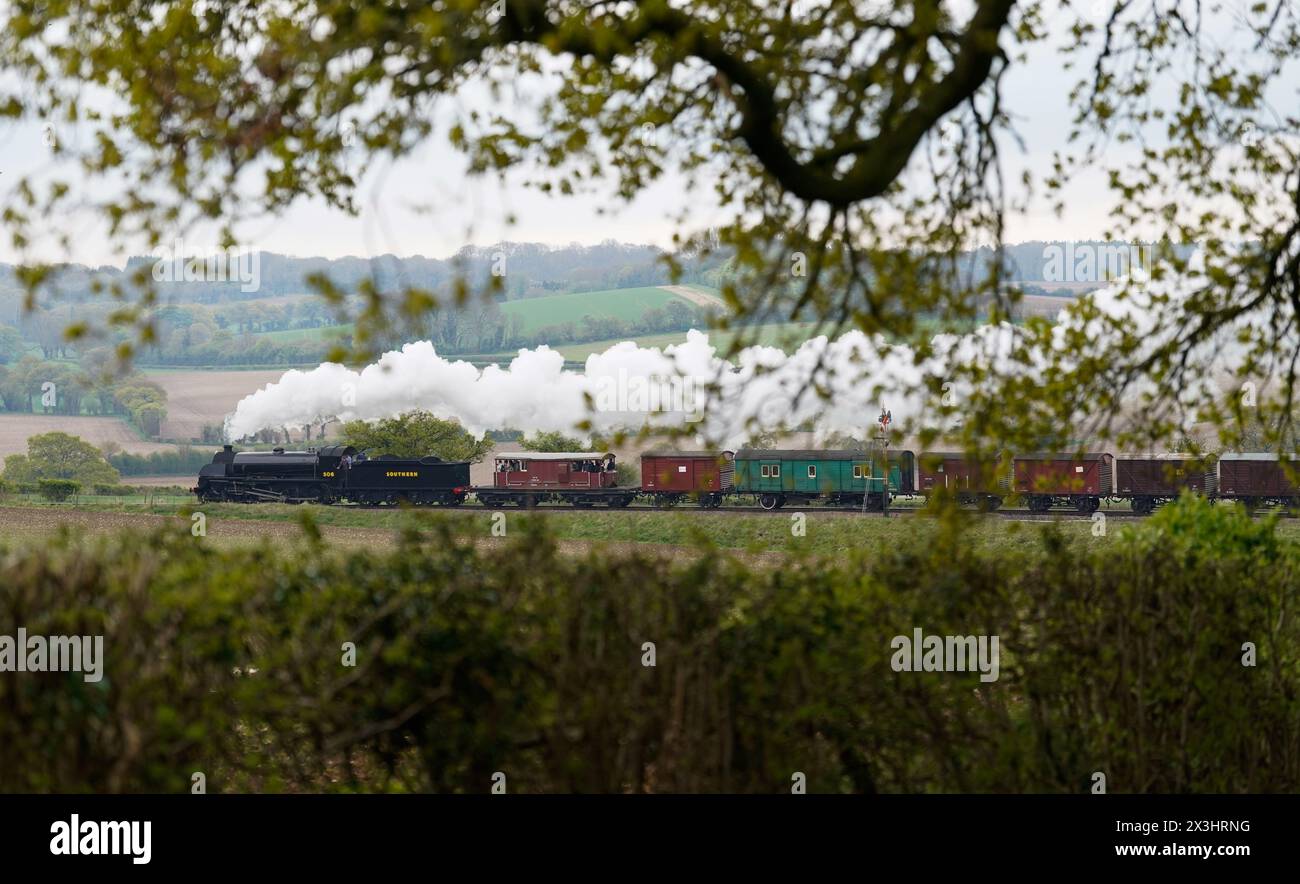 The S15 class steam locomotive 506, pulls carriages from Alresford ...