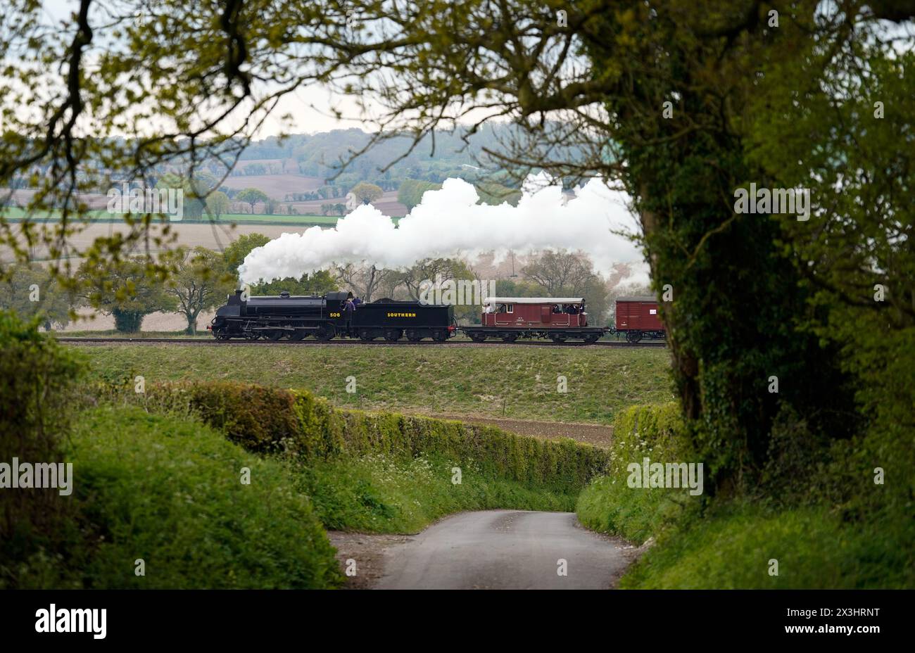 The S15 class steam locomotive 506, pulls carriages from Alresford ...