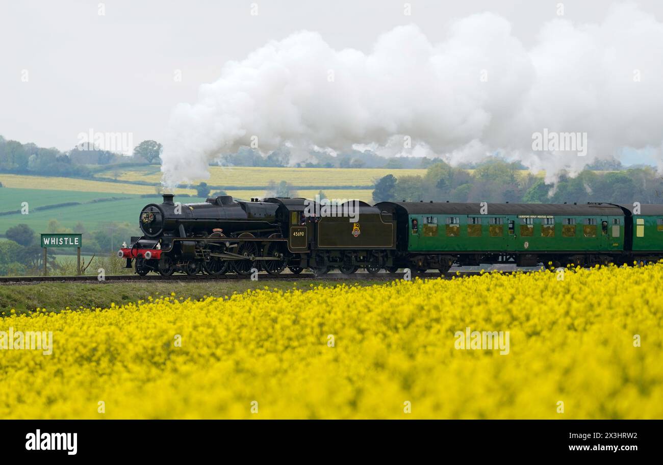 LMS Jubilee Class steam locomotive no.45690 'Leander', pulls carriages ...