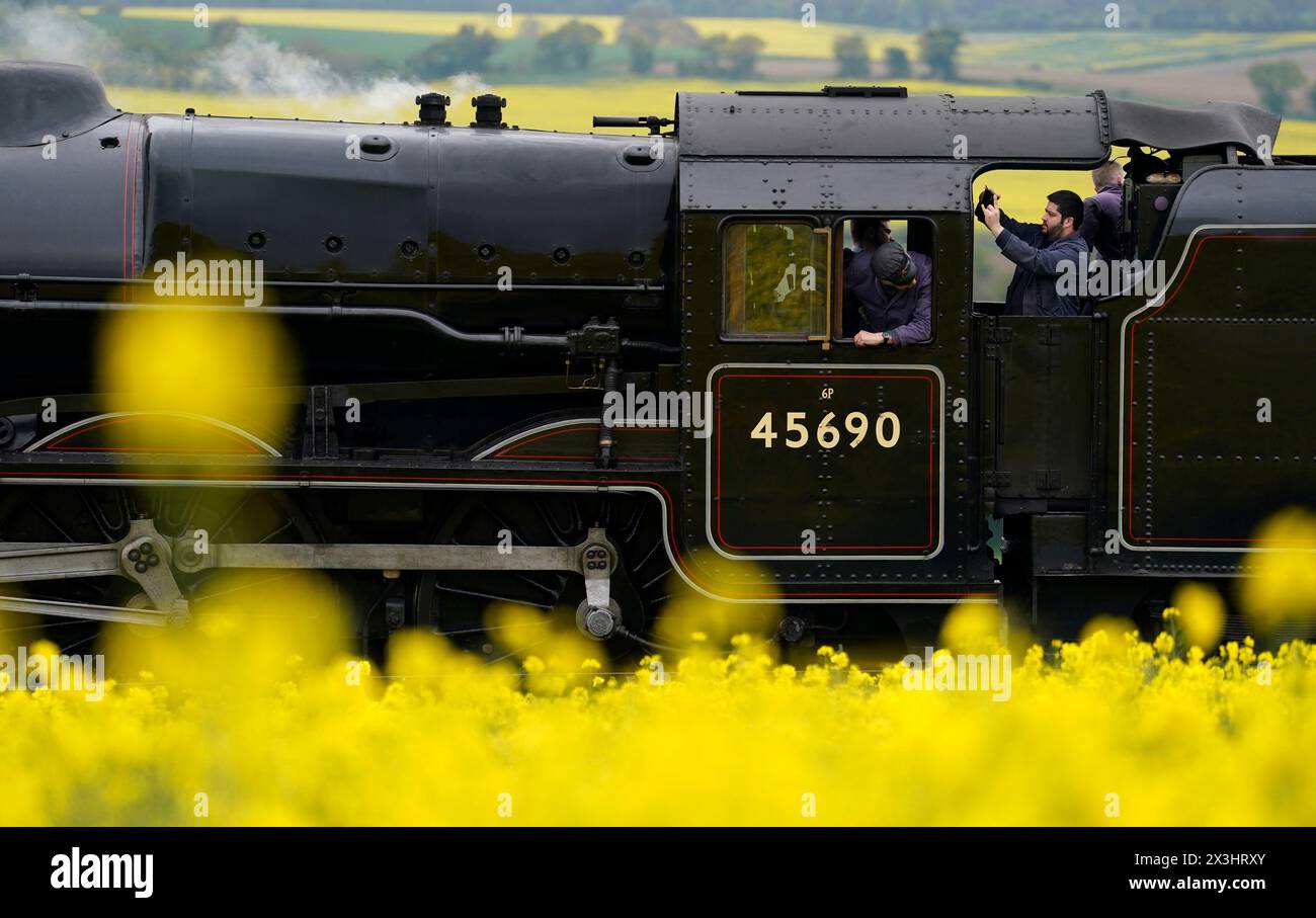 A person takes a photograph out of the driver's cab on LMS Jubilee ...
