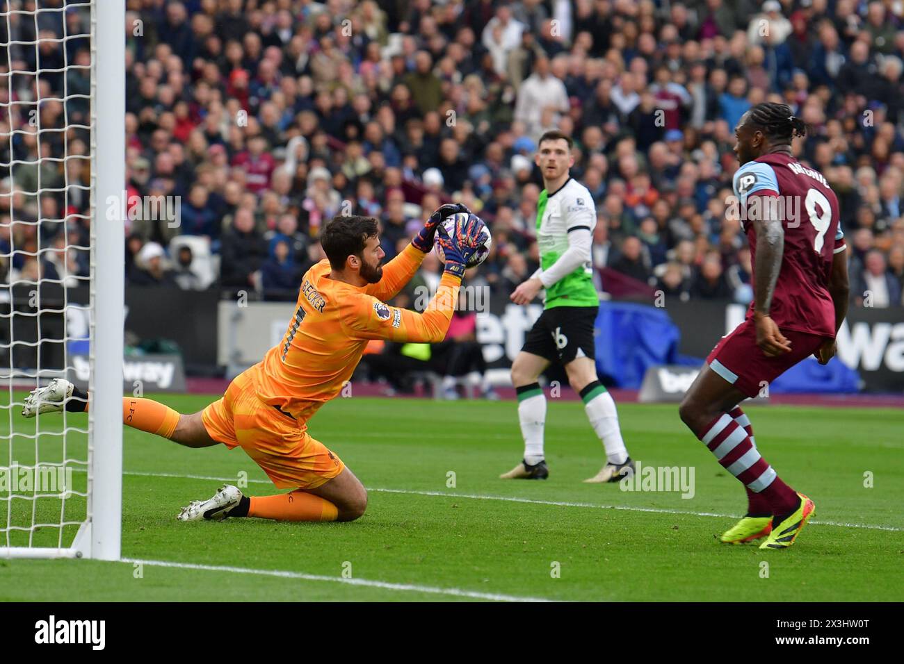 Alisson Becker of Liverpool FC makes an important save late in the ...