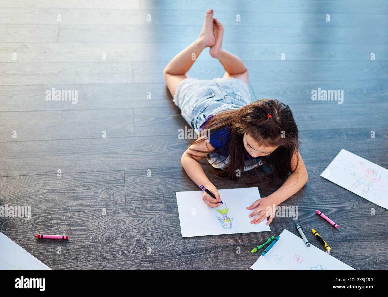 Female child, picture and drawing on ground in house with color pencil ...
