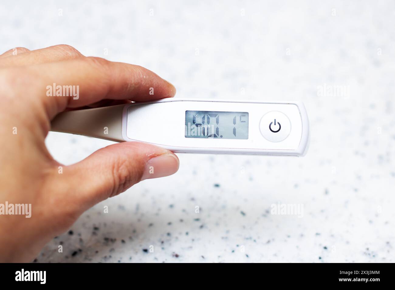 A rectangular measuring instrument, like a digital thermometer in ...