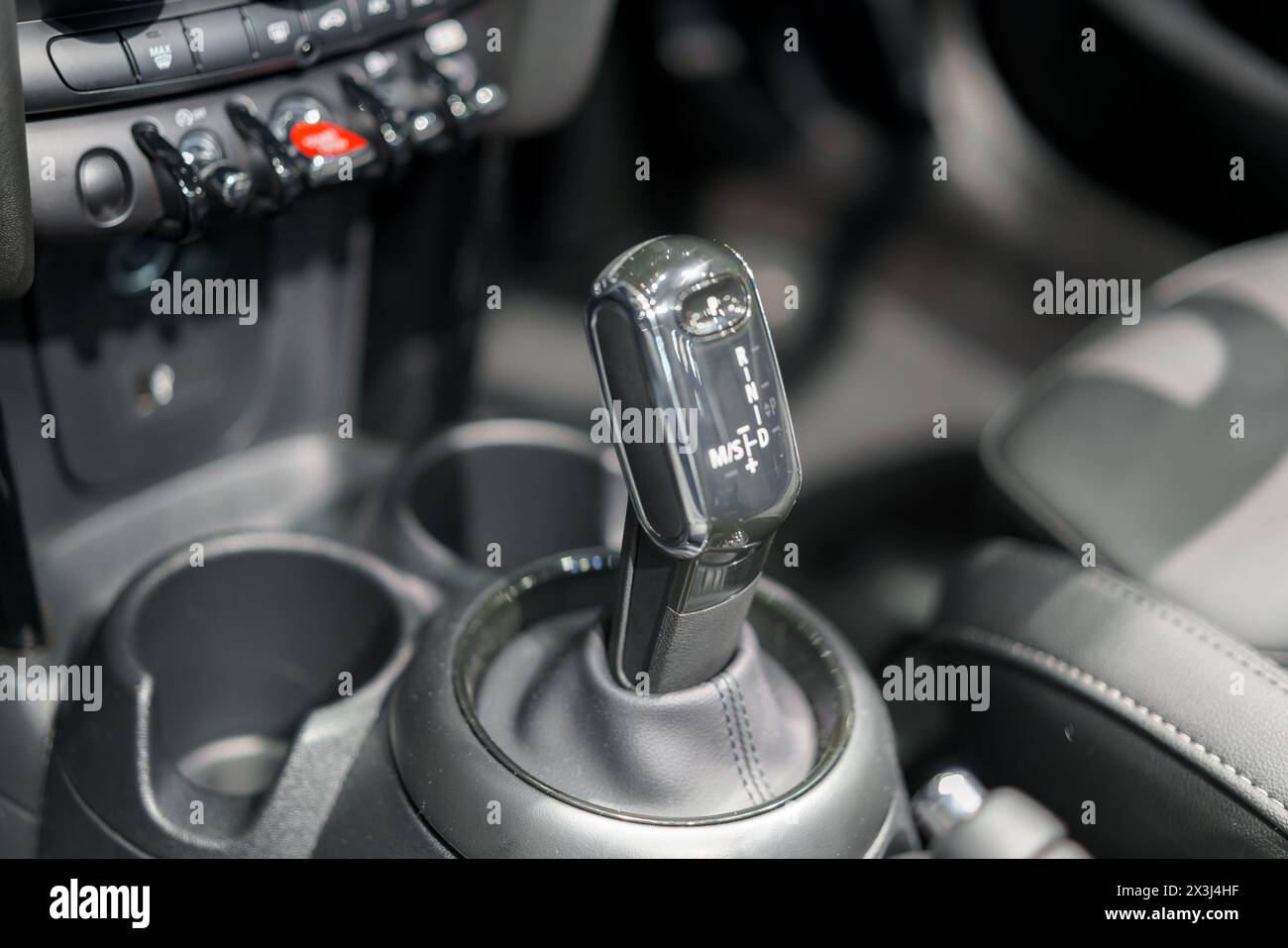 modern car's automatic gearbox and control buttons. This detailed shot ...