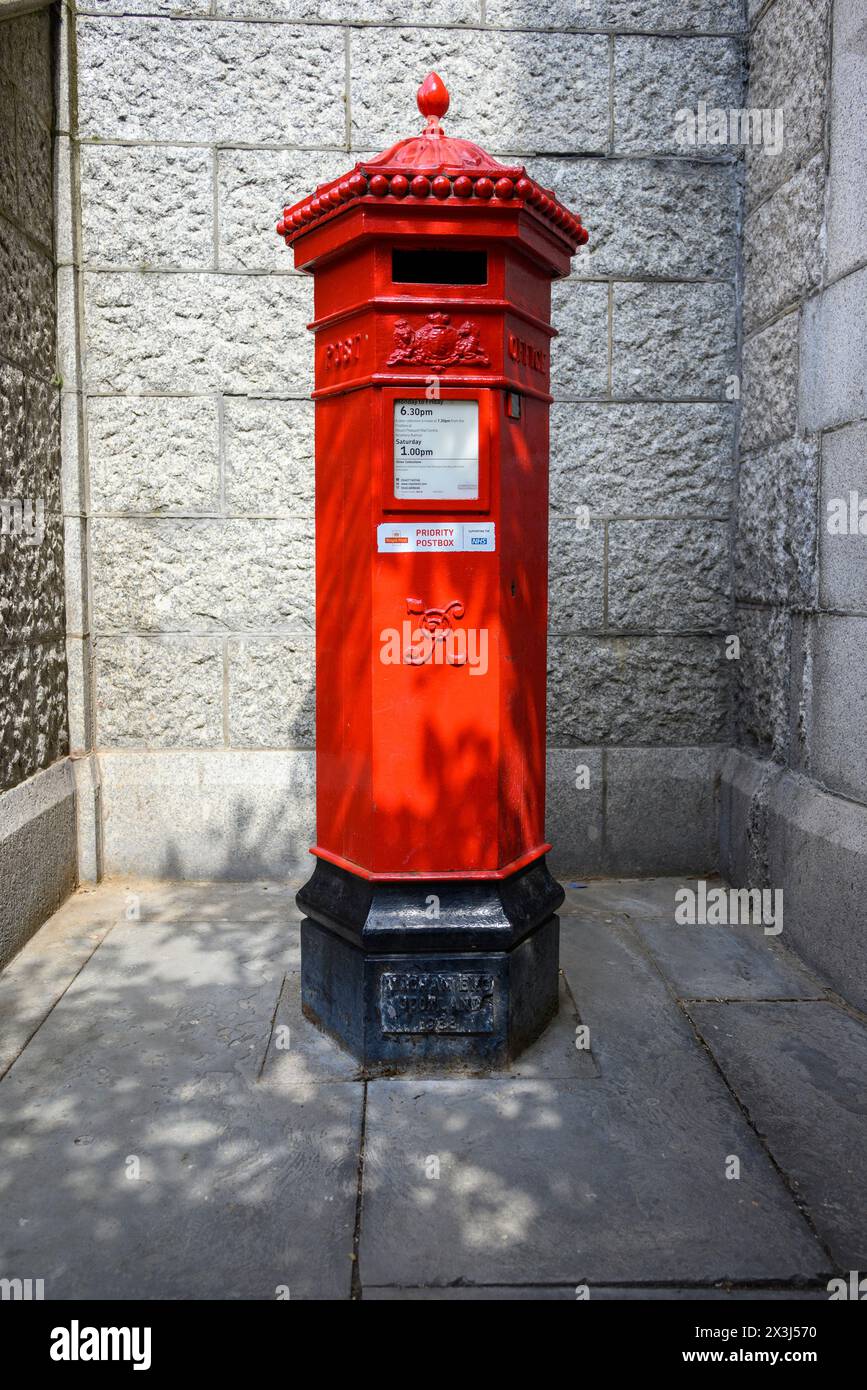 Hexagonal Royal Mail red post box, Tower Bridge, London Stock Photo - Alamy