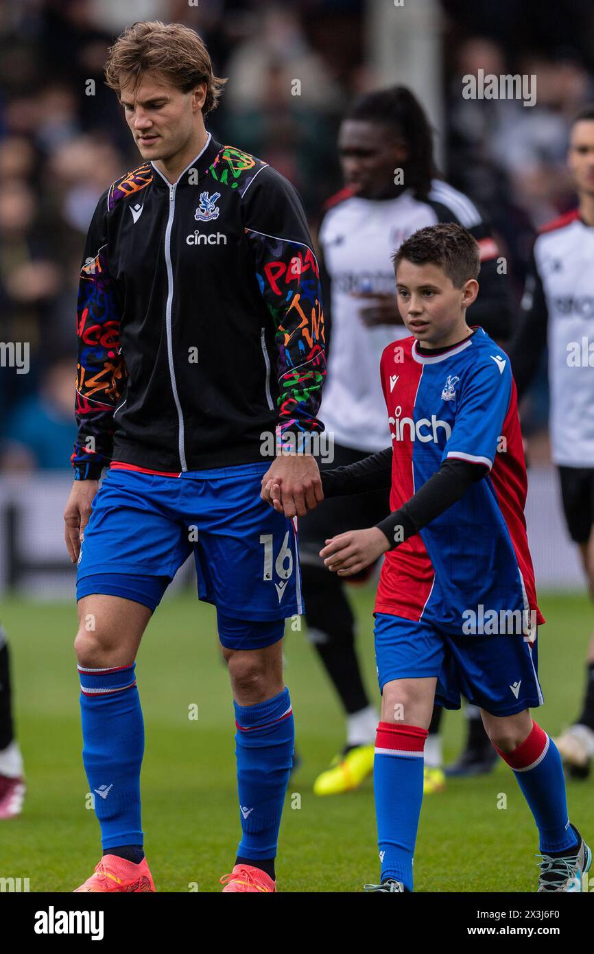 Joachim Andersen of Crystal Palace walks out with the mascot ahead of ...