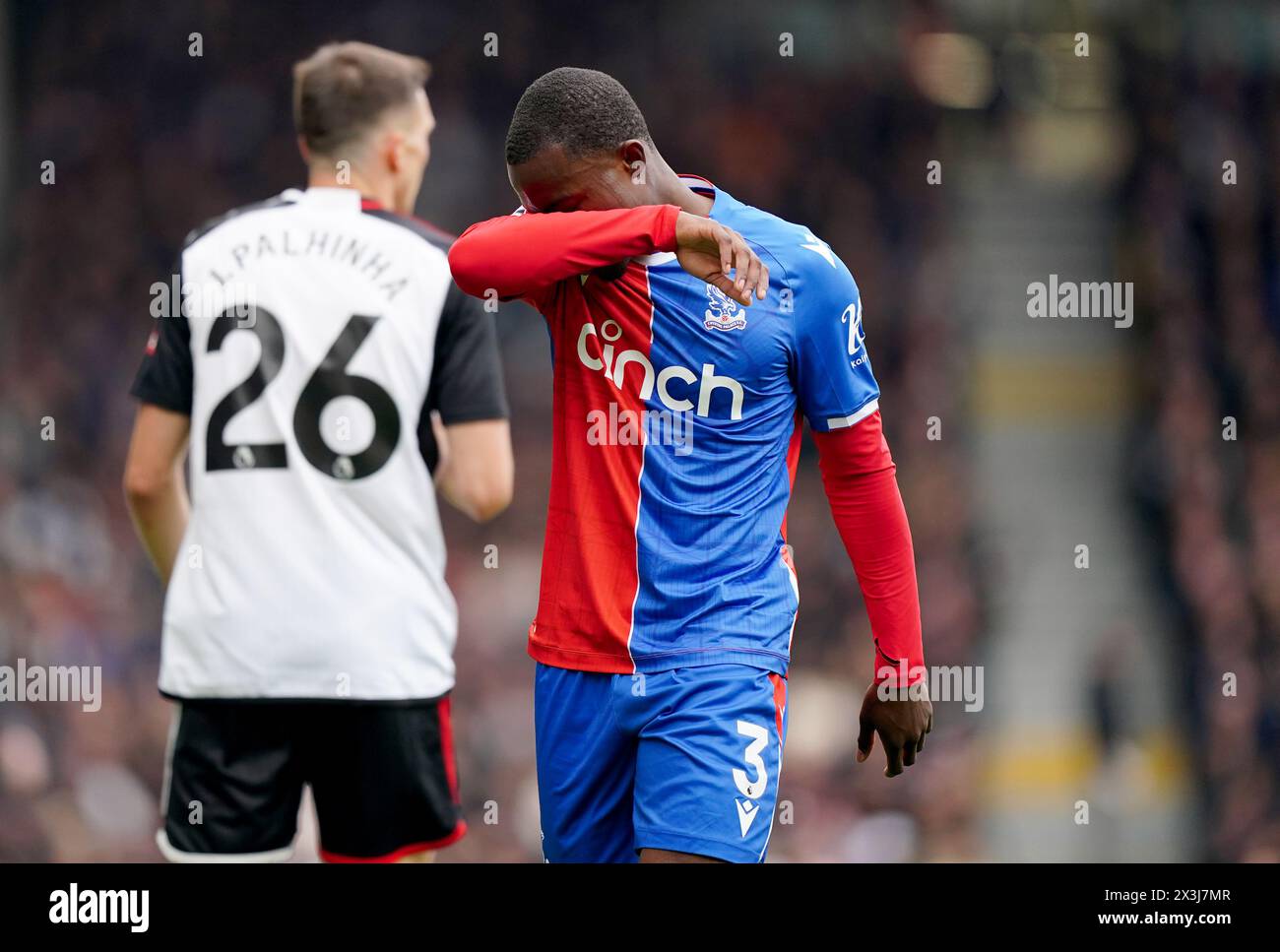 Crystal Palace's Tyrick Mitchell wipes his face with his arm during the ...