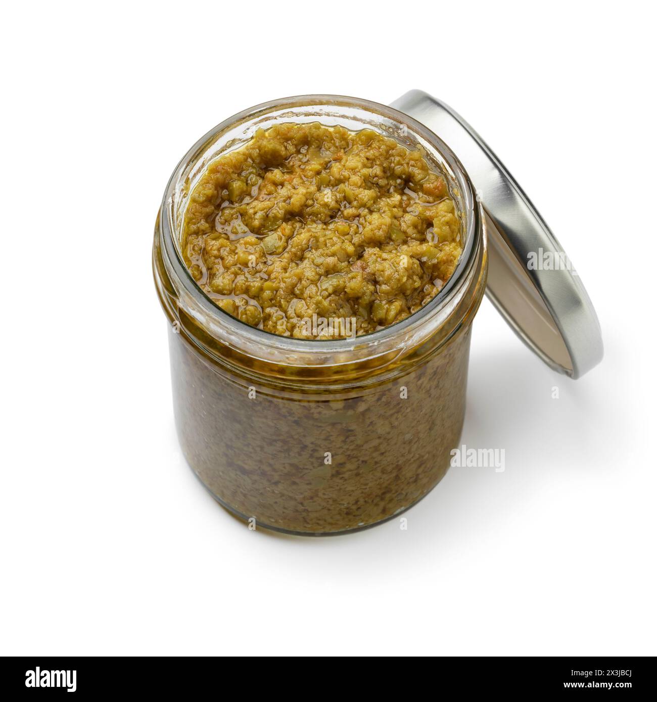 Glass jar with traditional homemade green olive tapenade close up ...
