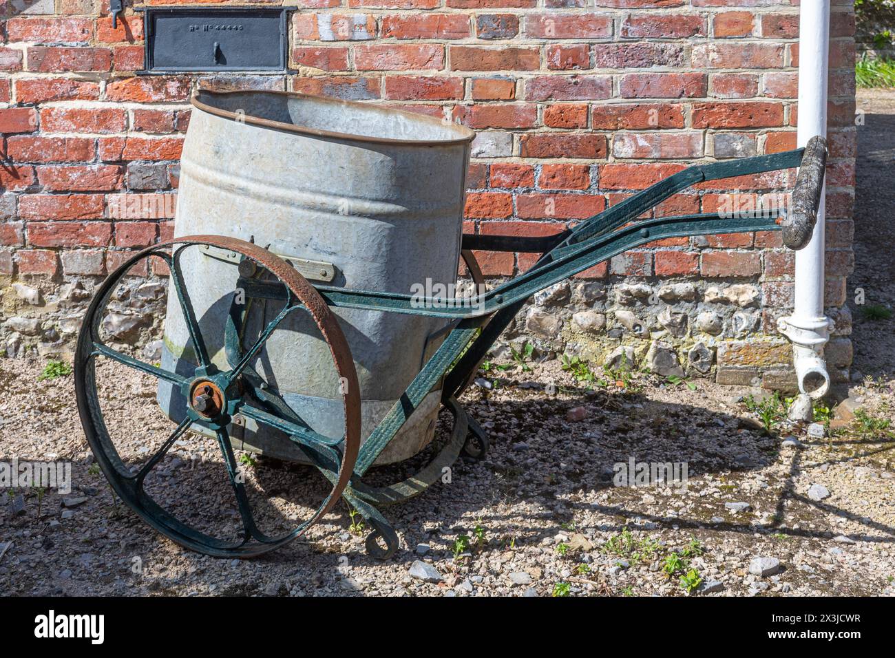 Old Victorian galvanised water bowser in a garden, UK Stock Photo - Alamy