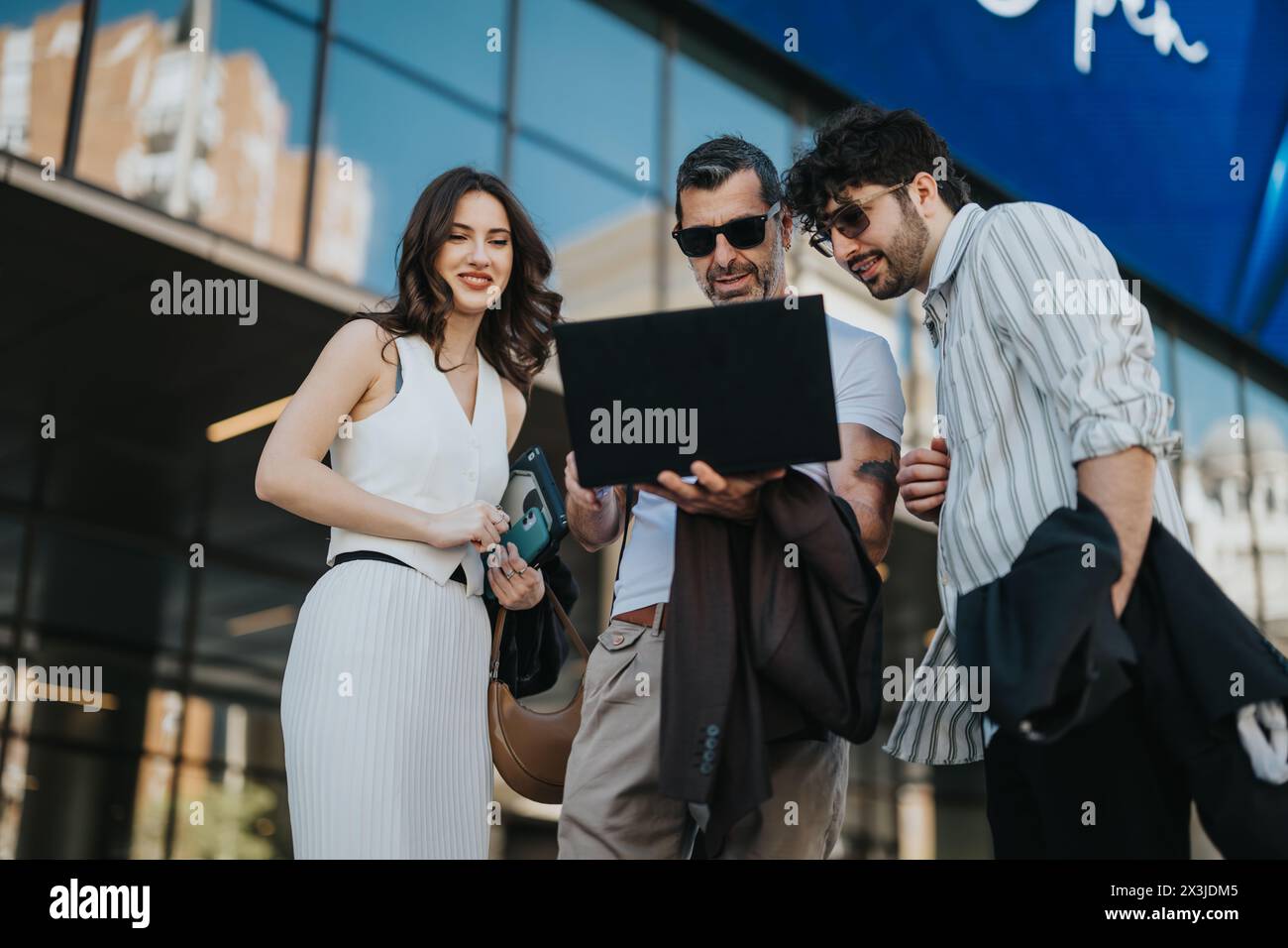 Multigenerational team analyzing business hi-res stock photography and ...