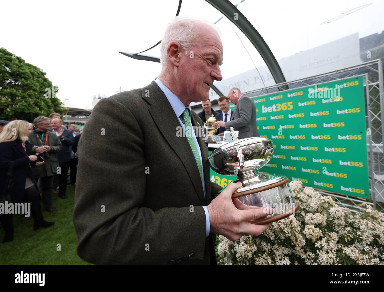 Winning trainer Willie Mullins poses with the Champion Trainer trophy ...