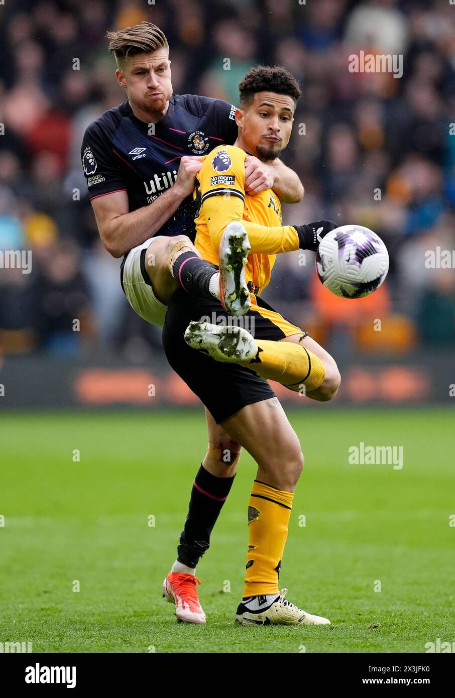 Wolverhampton Wanderers' Joao Gomes (right) and Luton Town's Reece ...