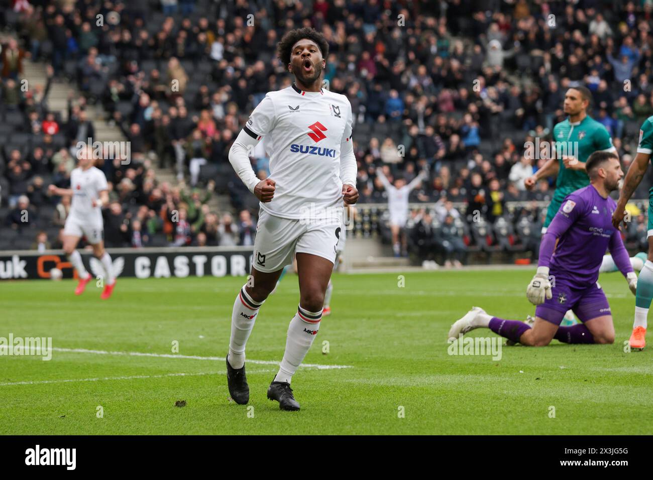 Ellis Harrison celebrates after scoring for Milton Keynes Dons, to ...