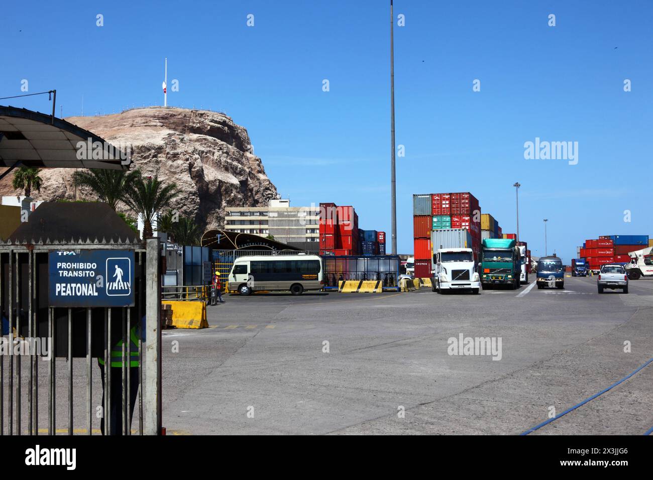 Trucks and containers stacked up in container port, El Morro headland ...