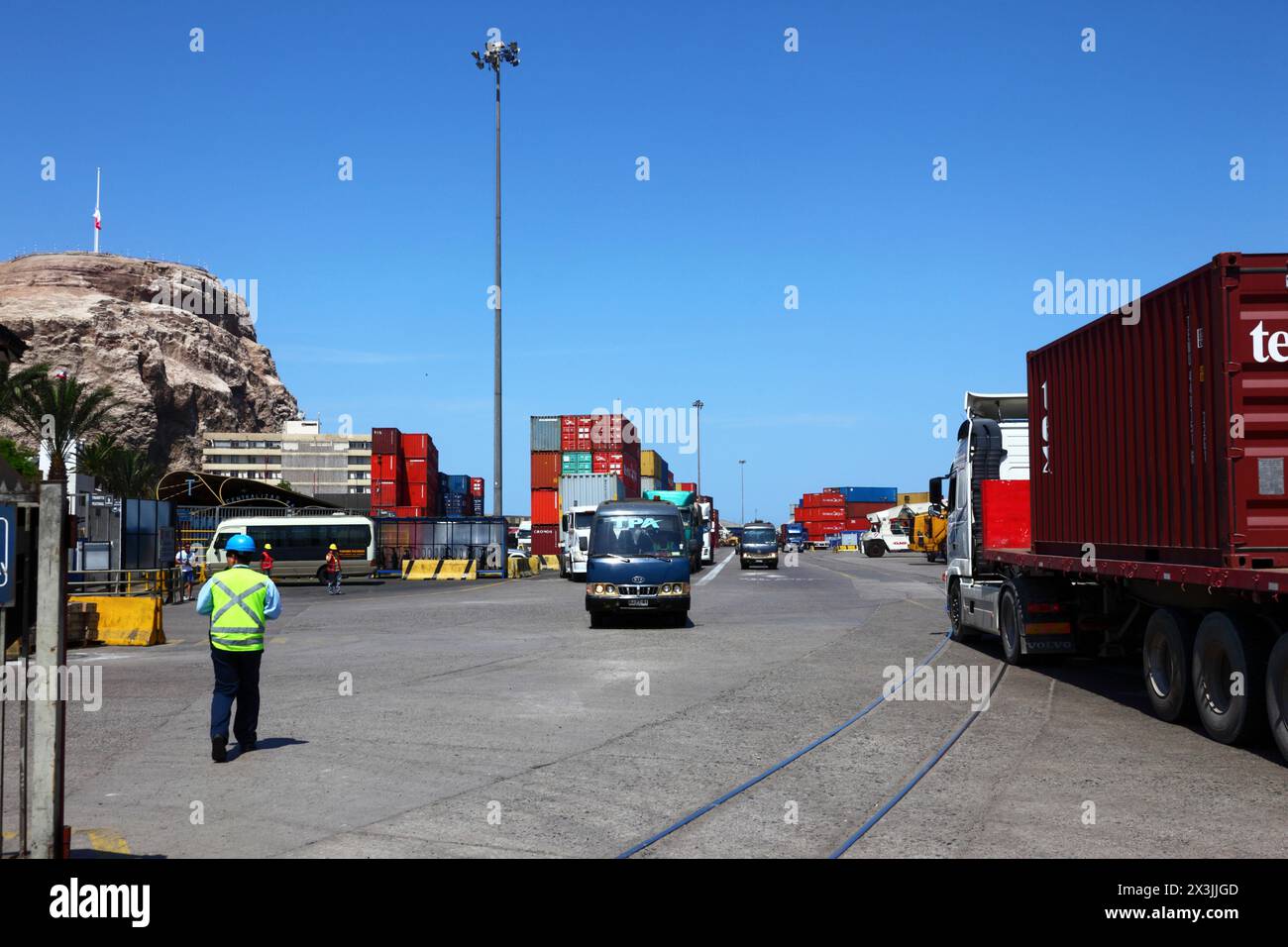 Container truck entering port, containers stacked up in background, El ...