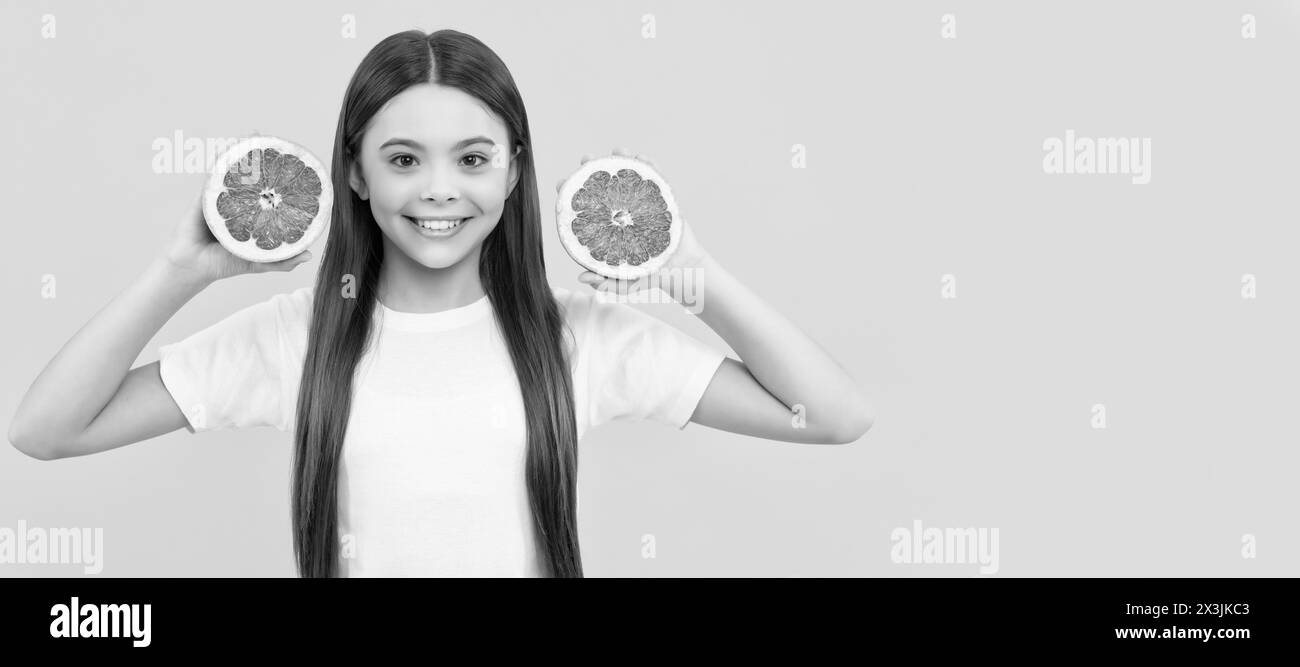 glad teen girl with grapefruit. vitamin and dieting. child eating ...