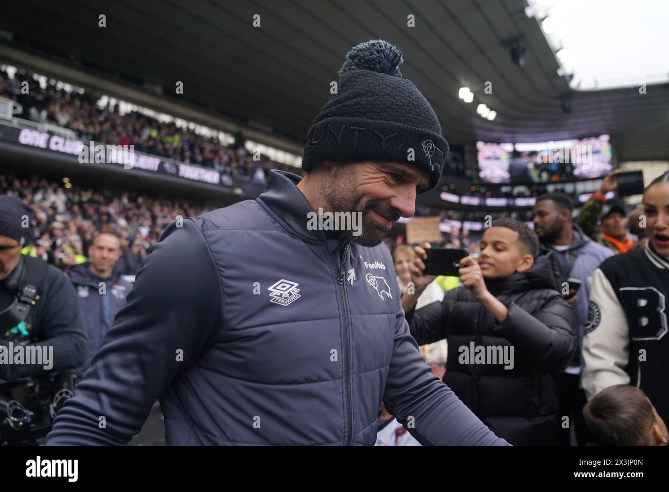 Derby County manager Paul Warne smiles after the final whistle of the ...