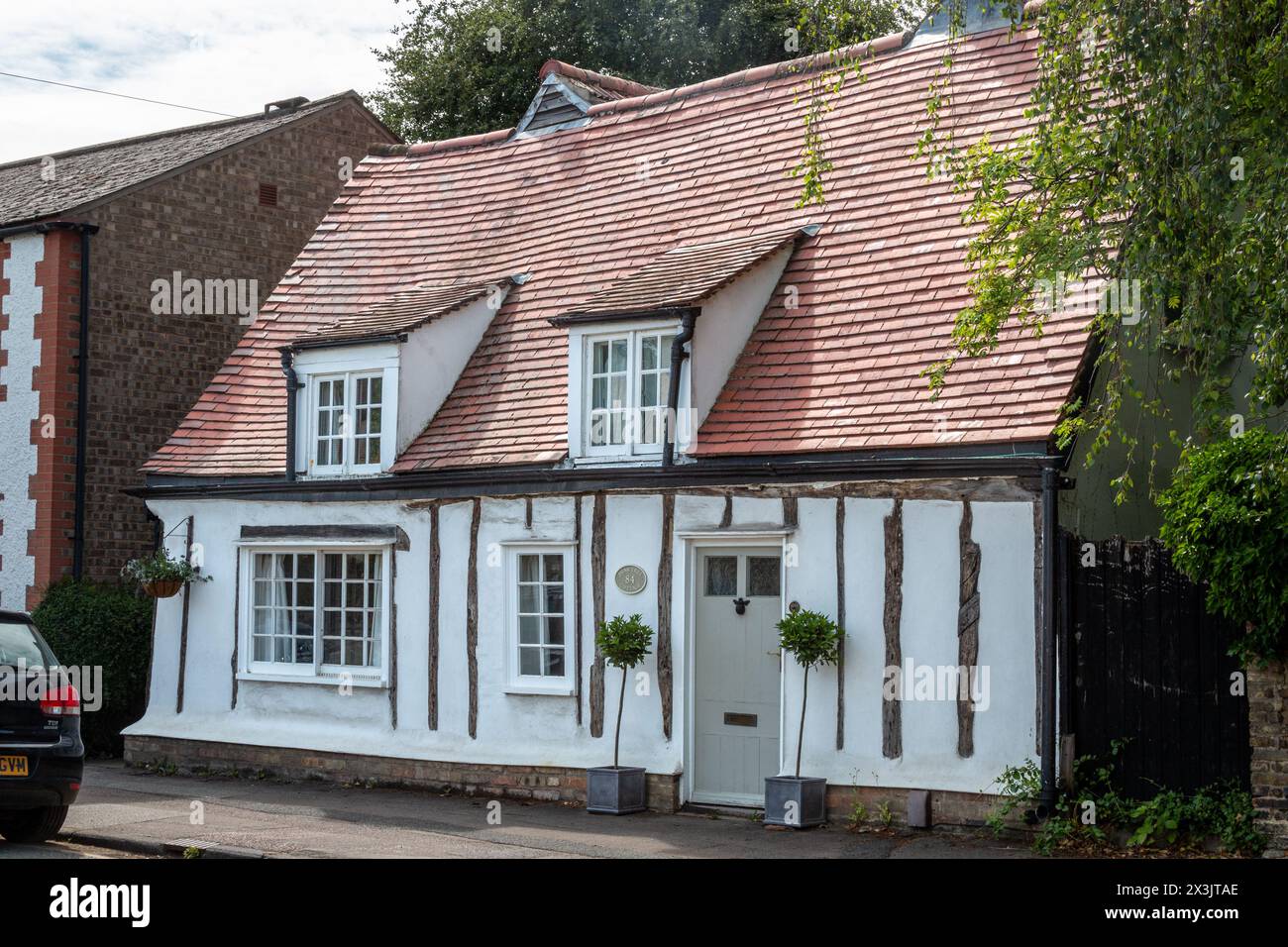 Pear Tree Cottage, a charming old white cottage with red tiled roof ...