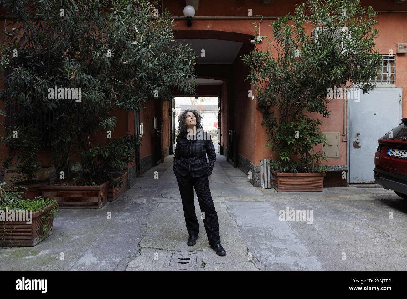 Portrait of Maria Grazia Calandrone in the courtyard of Viale Monza ...