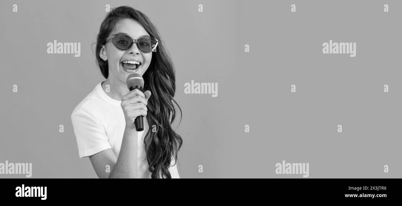 Music is what I am. Happy child sing song. Karaoke and live music. Girl ...