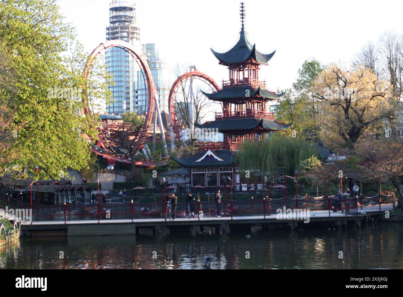 a large, grandiose amusement park with many attractions, roller ...