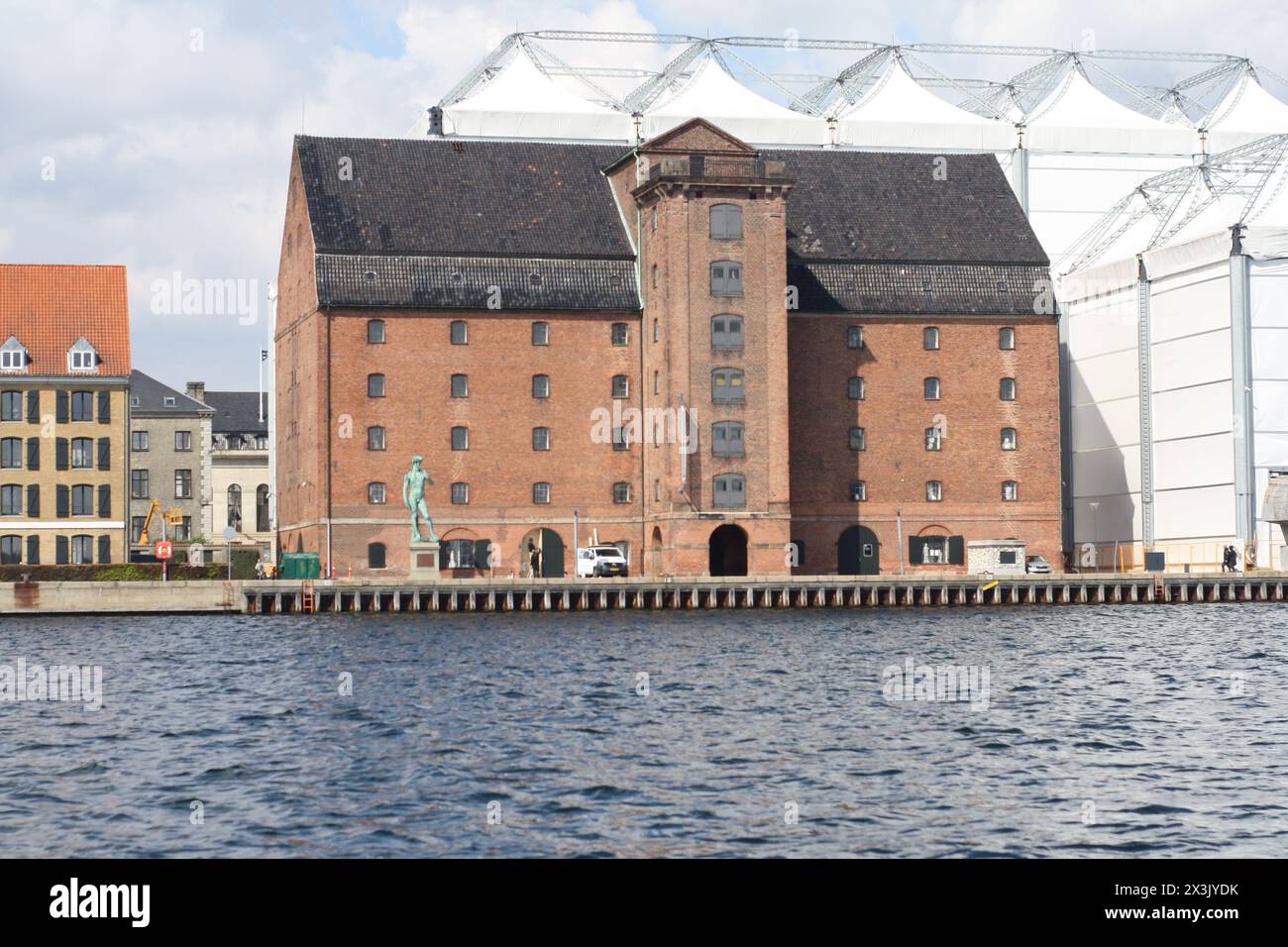 monumental building with brick façade and lake in Copnehagen Stock ...