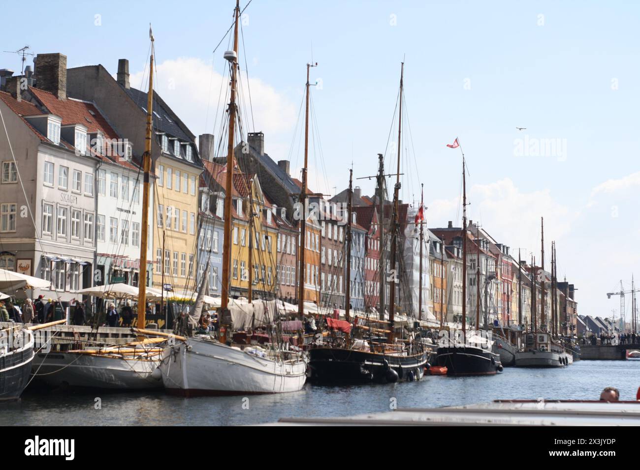 old port decorated with old buildings and ships as a tourist attraction ...