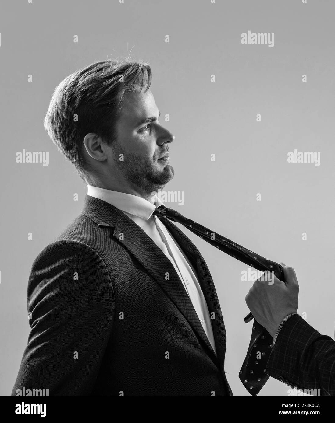 Professional employee man being pulled by necktie during workplace ...