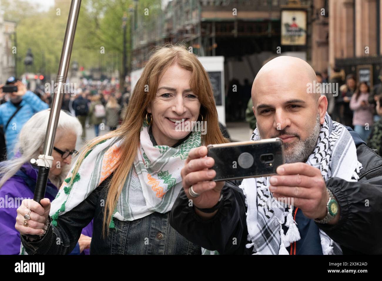 London, UK. 27 April, 2024. A protester grabs a selfie with Irish MEP ...