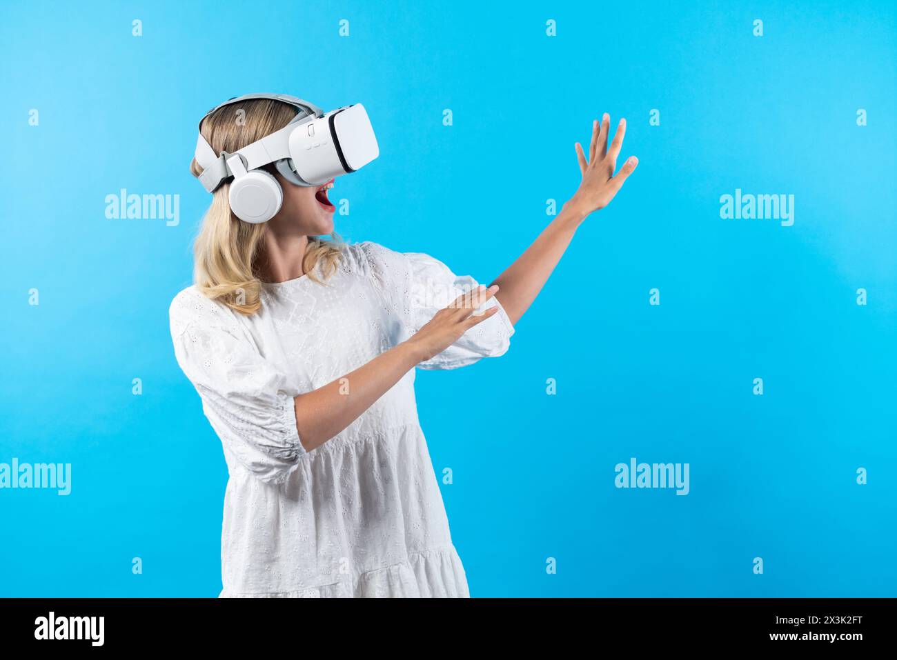 Skilled girl in pajamas excited with metaverse by using VR goggle at ...