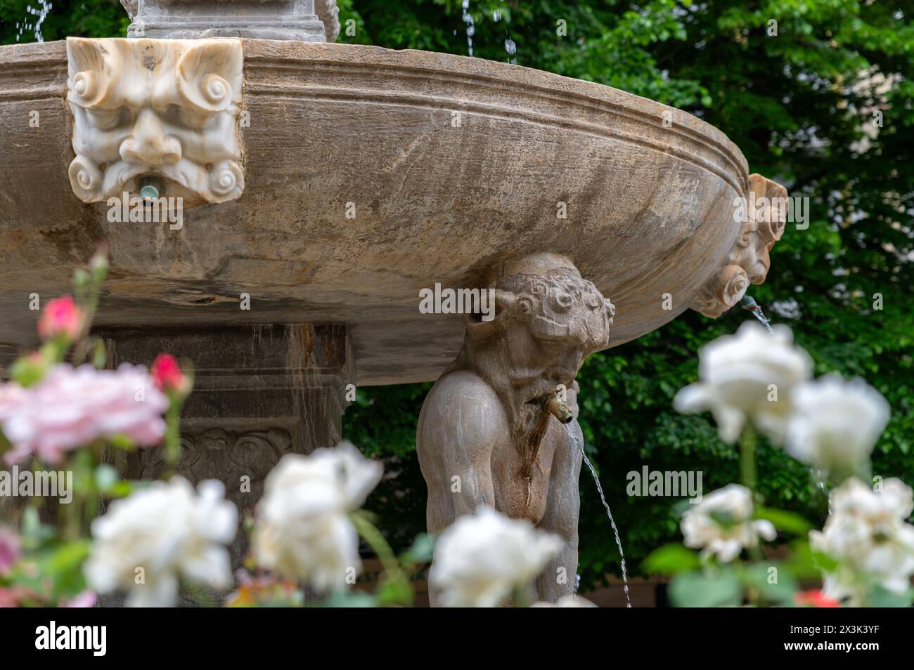 View of the Fountain of the Gigantones among flowers in the Bib-Rambla ...