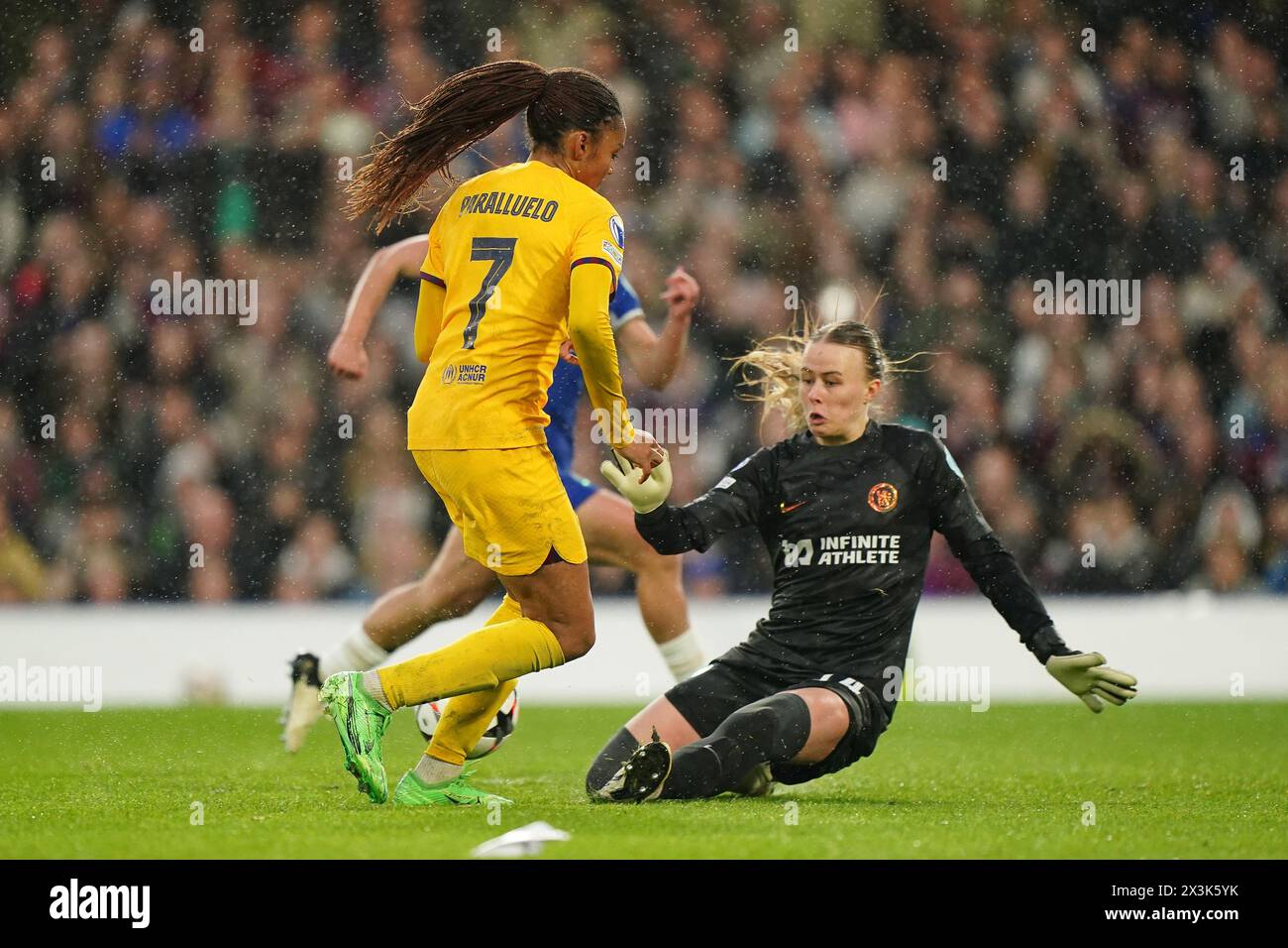 Chelsea goalkeeper Hannah Hampton saves at the feet of Barcelona's ...