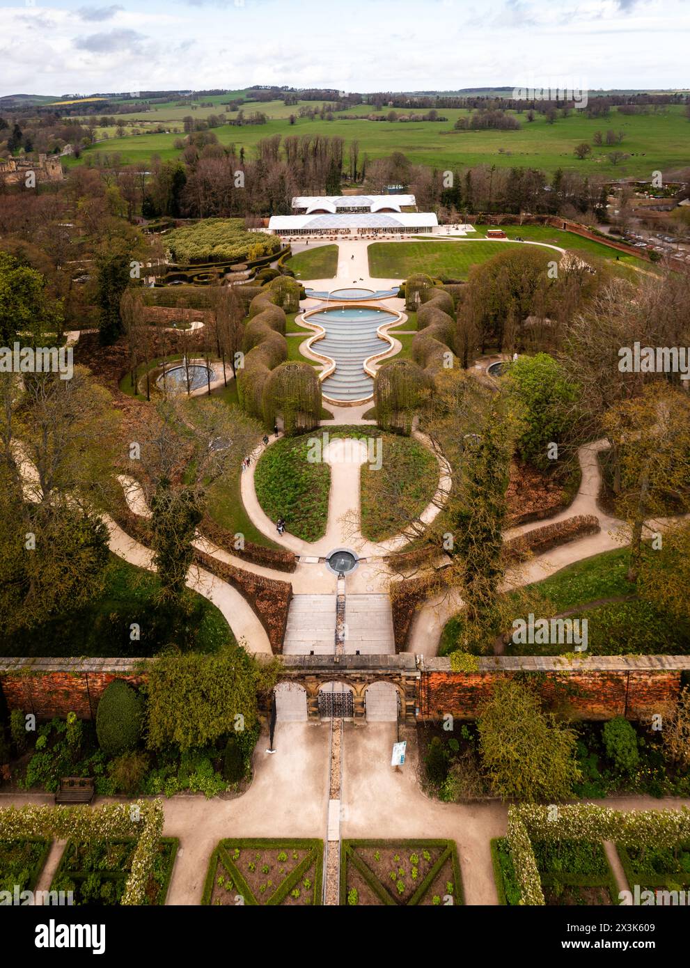 ALNWICK GARDENS, NORTHUMBERLAND, UK - APRIL 19, 2024. Aerial vertorama ...