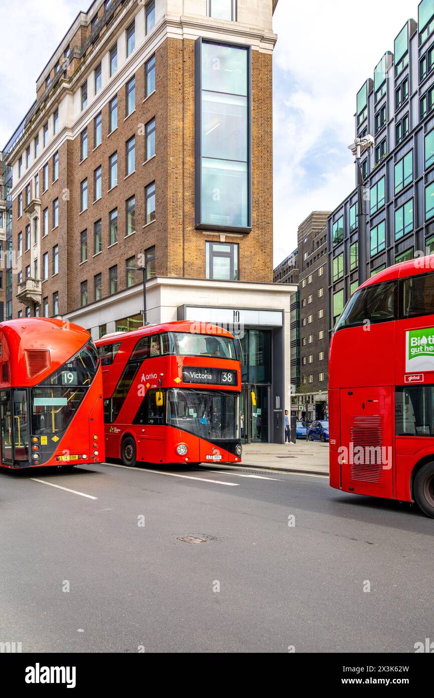 Modern and classic buses on London street Stock Photo - Alamy