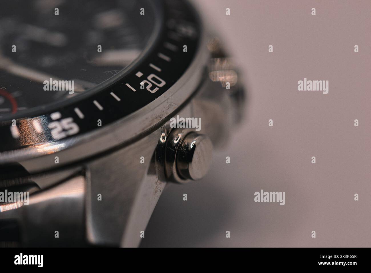 Close-up of a stainless steel watch showing detailed texture and focus ...